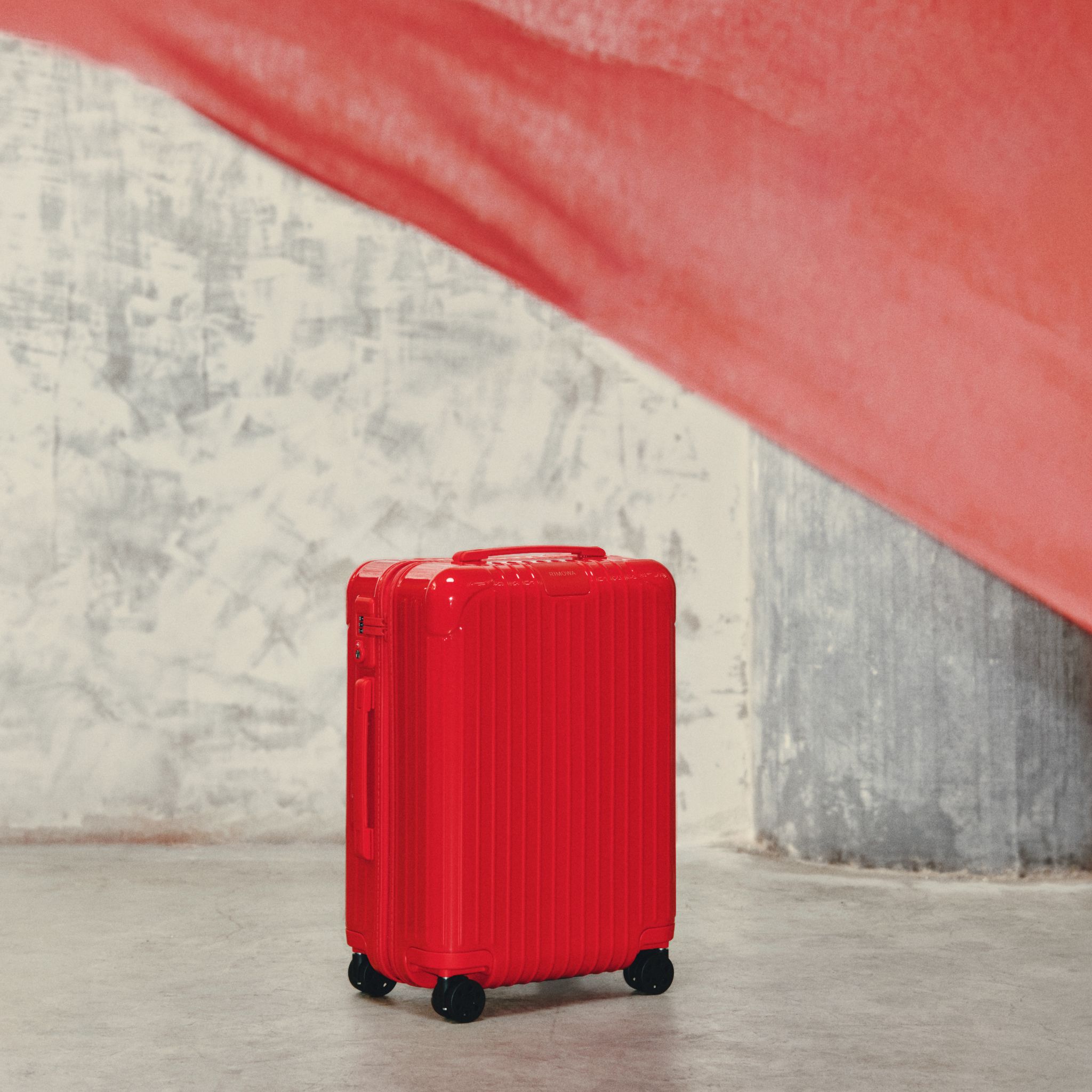 RIMOWA introduces new vibrant red colour to the Essential range - NYLON